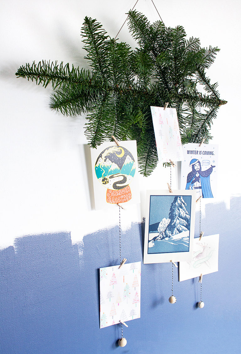 This DIY branch holiday card display shows off your cards in style